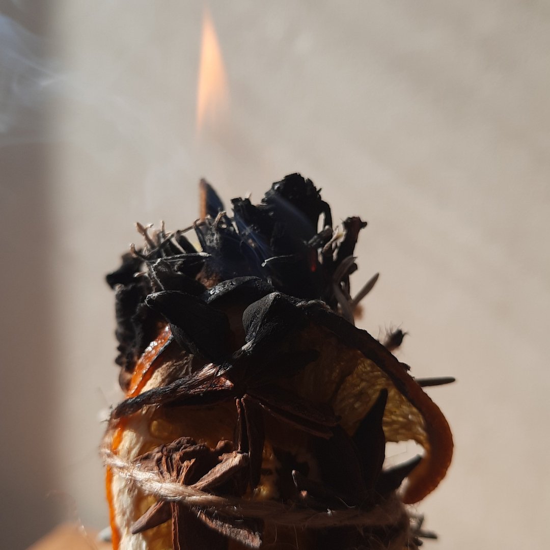 How do I extinguish a burning smudging stick? – Sacred